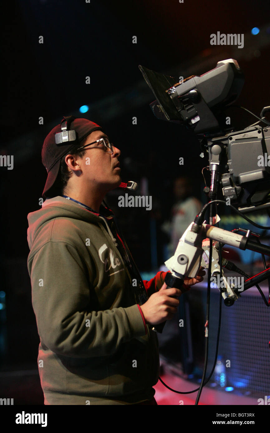 Camera operator filming a television show Stock Photo - Alamy