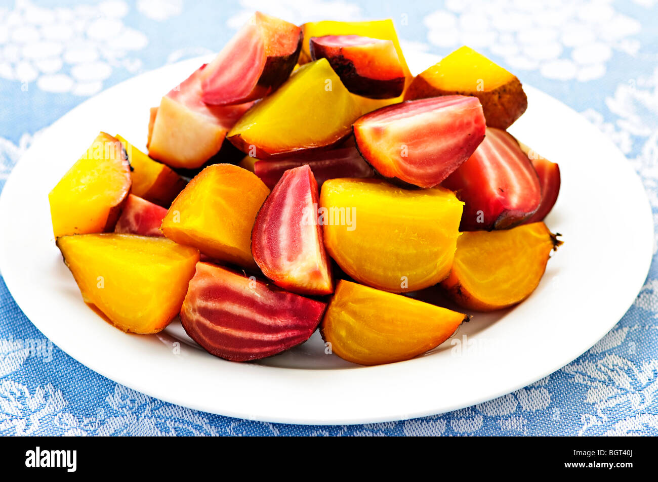 Roasted sliced red and golden beets on a plate Stock Photo - Alamy