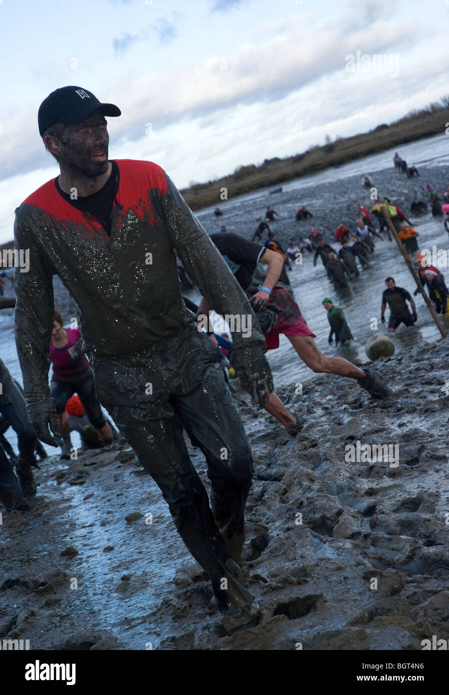a fun runners finally crosses the finish line at the maldon mud race ...