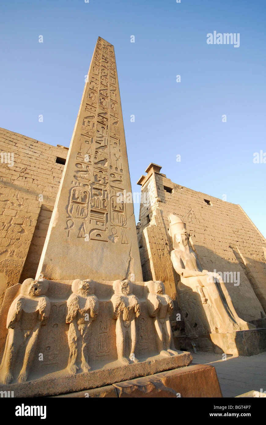 LUXOR, EGYPT. The obelisk at Luxor Temple, with pylon and Colossi of ...
