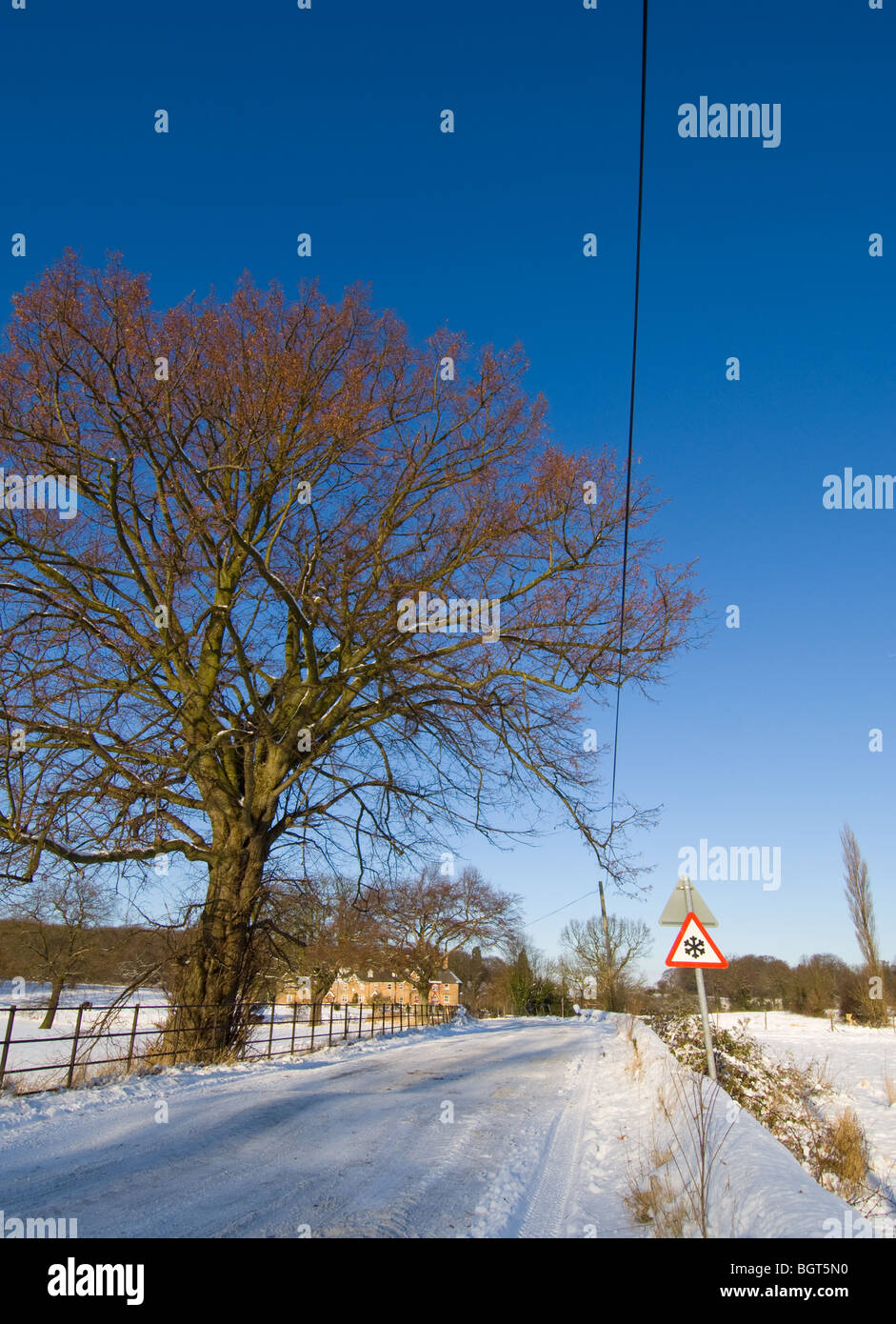 Warning sign, icy conditions informing motorist of the hazard on the ...
