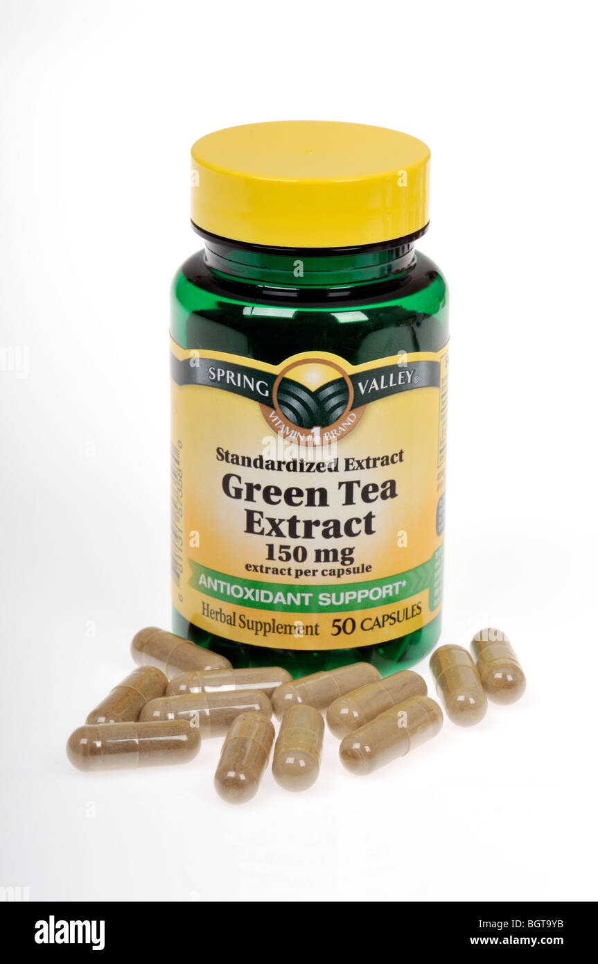 Many capsules and a bottle of Green Tea Extract herbal supplement Stock ...
