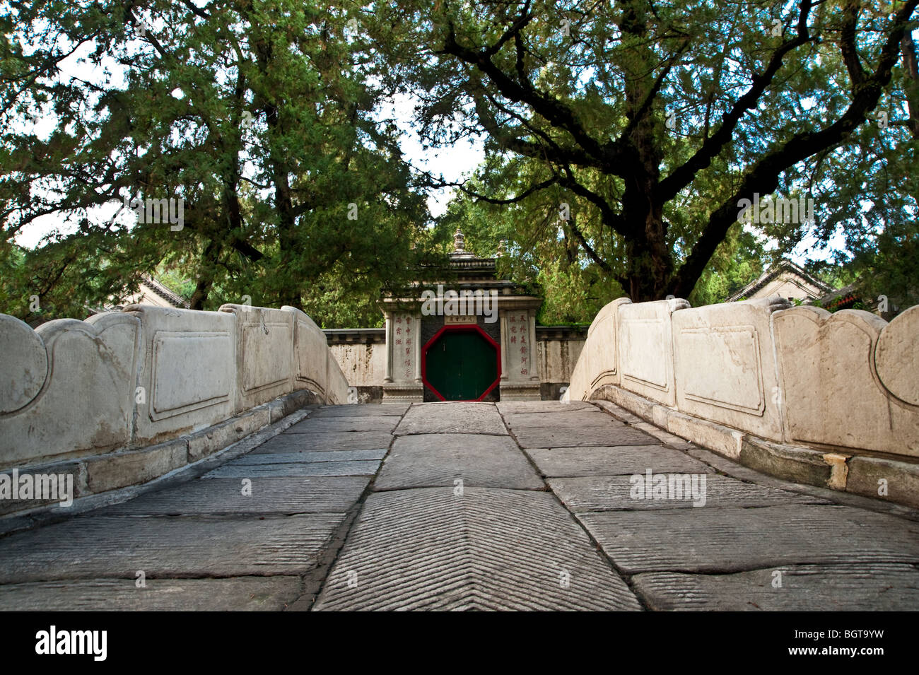A traditional Chinese stone bride leads to a yard gate Stock Photo - Alamy