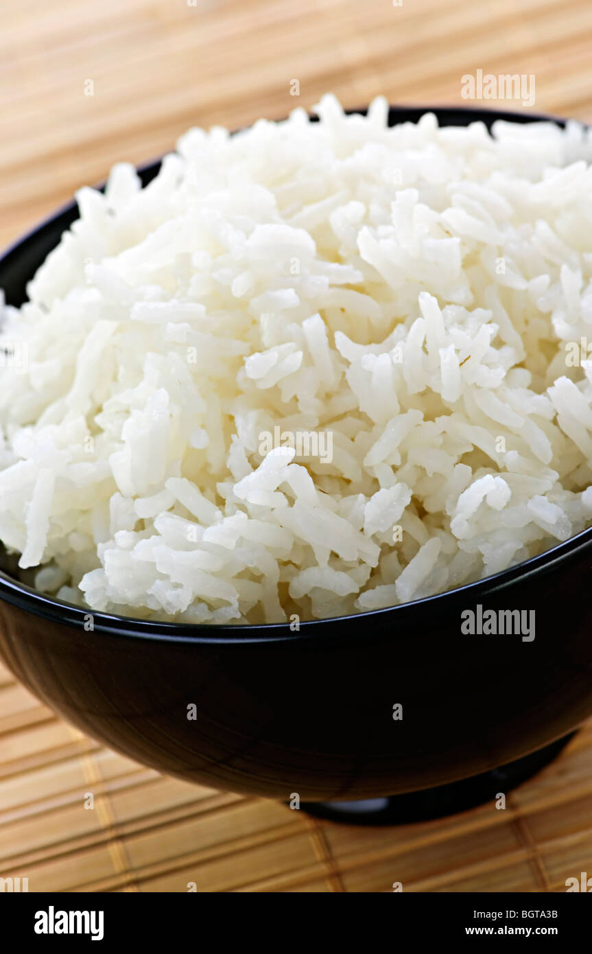 White steamed rice in black round bowl Stock Photo - Alamy