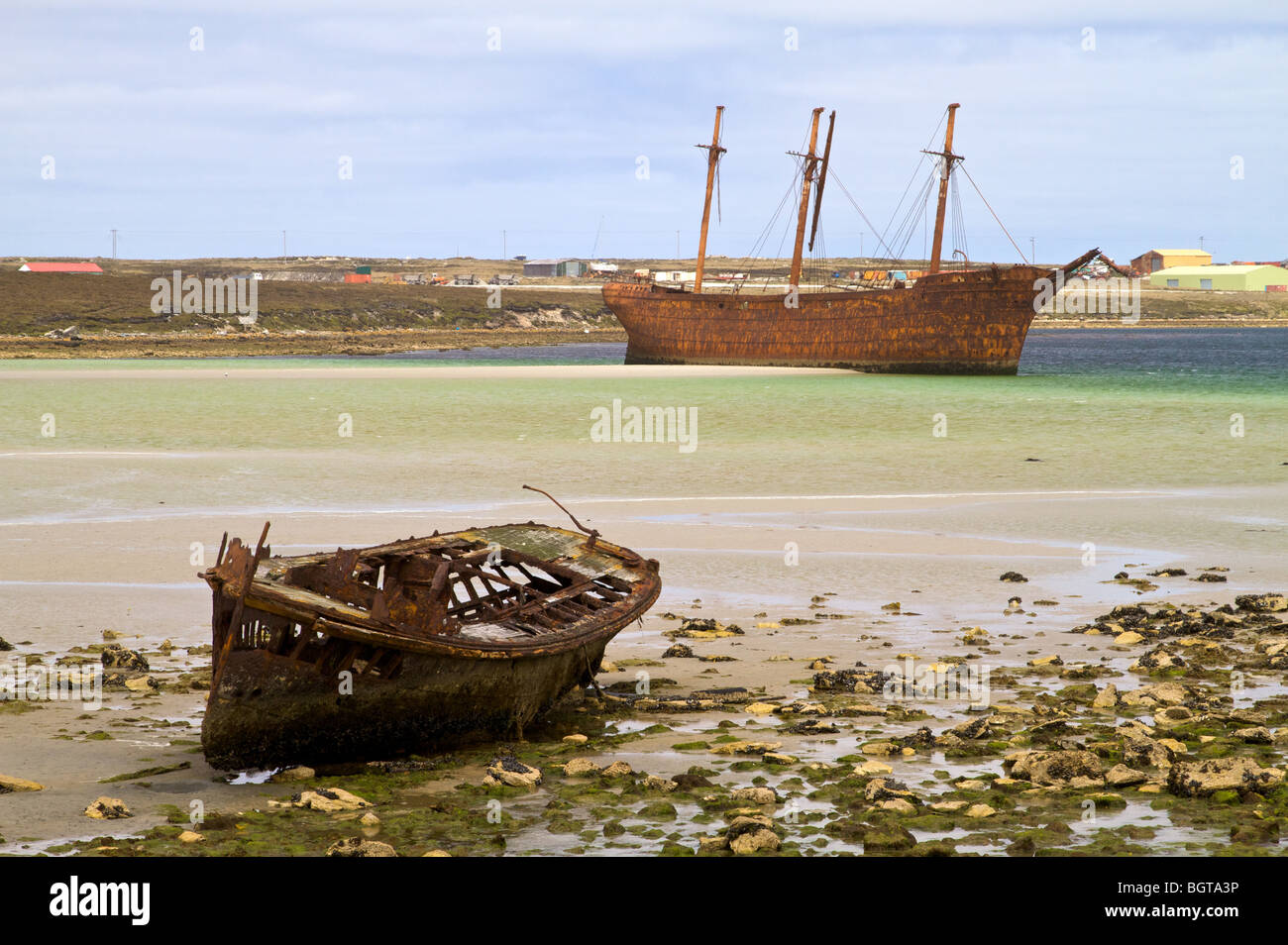 Nineteenth Century sailing ship (background) wrecked near Port Stanley ...