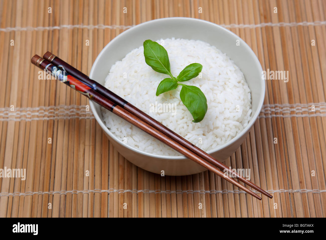 Bowl of white rice on tatami mat Stock Photo - Alamy