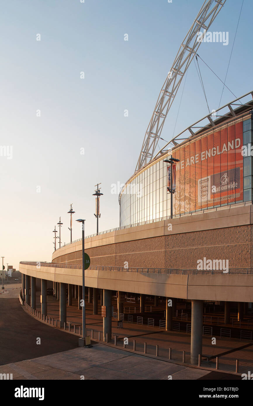 wembley stadium tight sunset shot with arch, façade and under-staidum ...