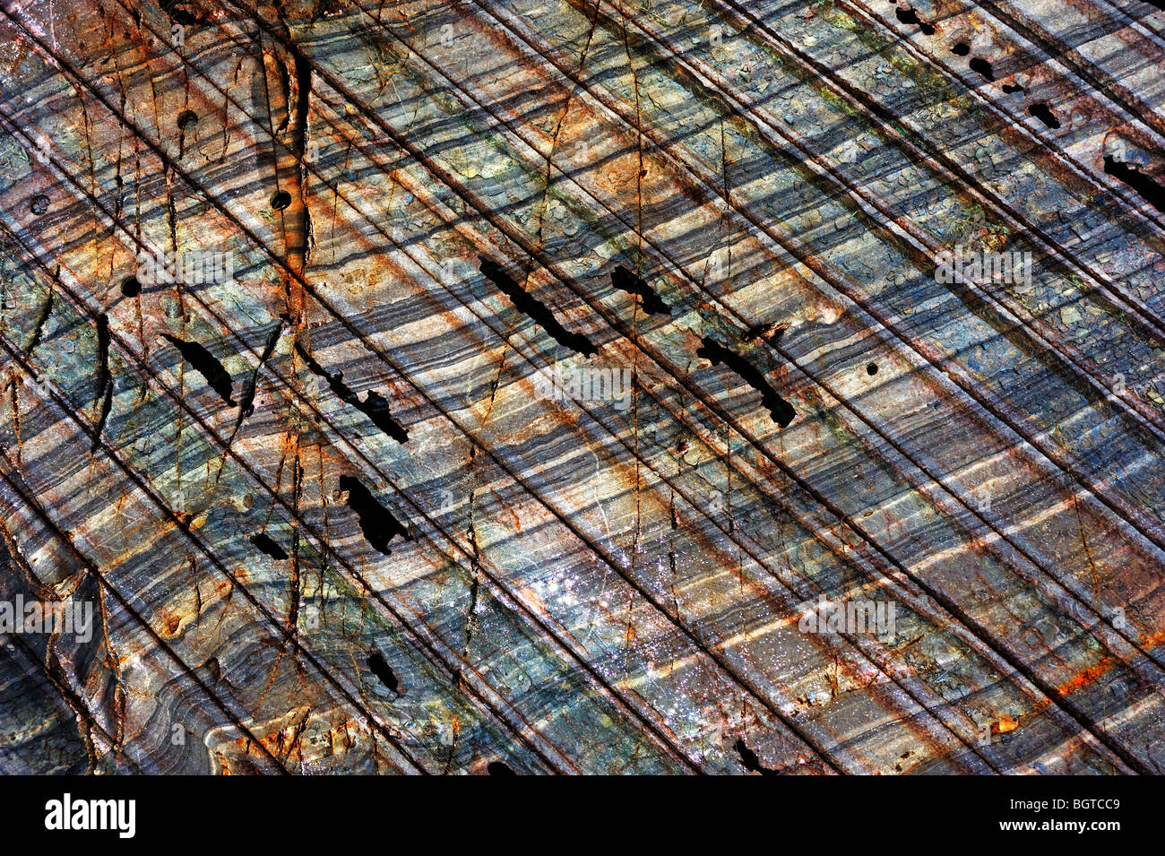 Texture made by combining images of rusty metal with images of rock ...