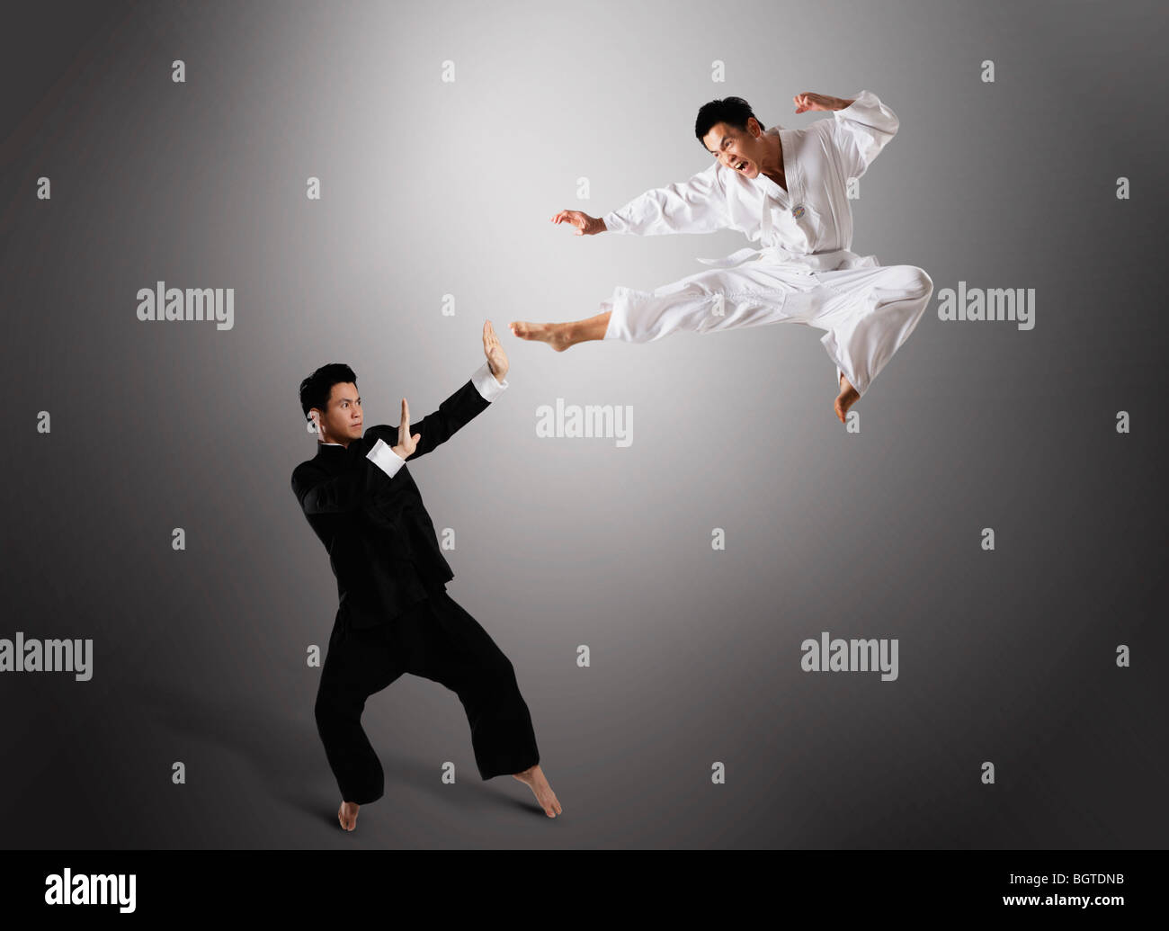 Two men fighting with martial arts Stock Photo - Alamy
