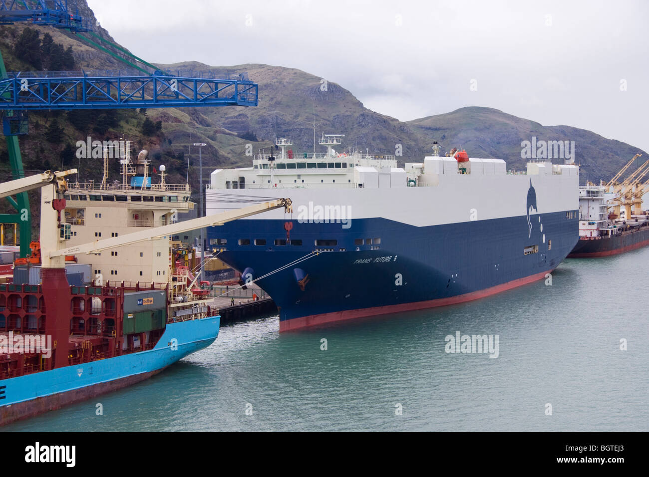 A large car carrying ship berthed amongst other ships at Lyttelton, New ...