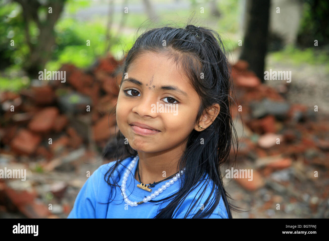 Local Child wearing a bindi smiling in a Coir Village in Alleppey ...
