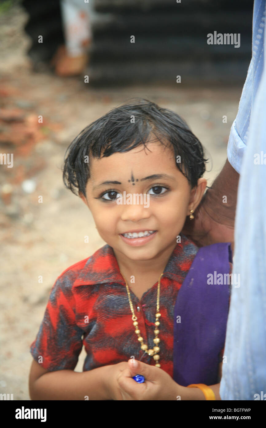 Local Child wearing a bindi smiling in a Coir Village in Alleppey ...