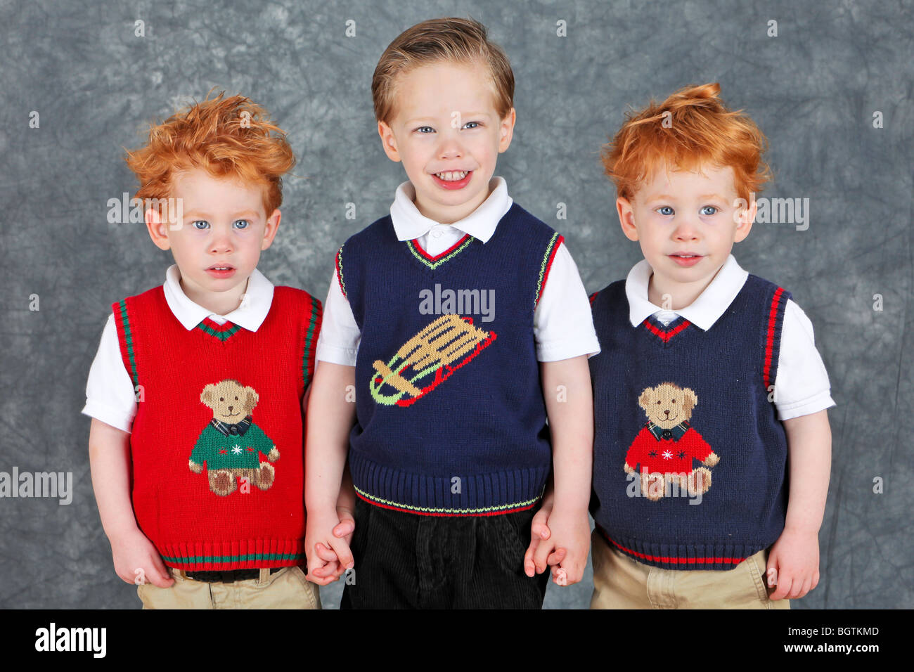 Cute three brothers christmas portrait hi-res stock photography and ...