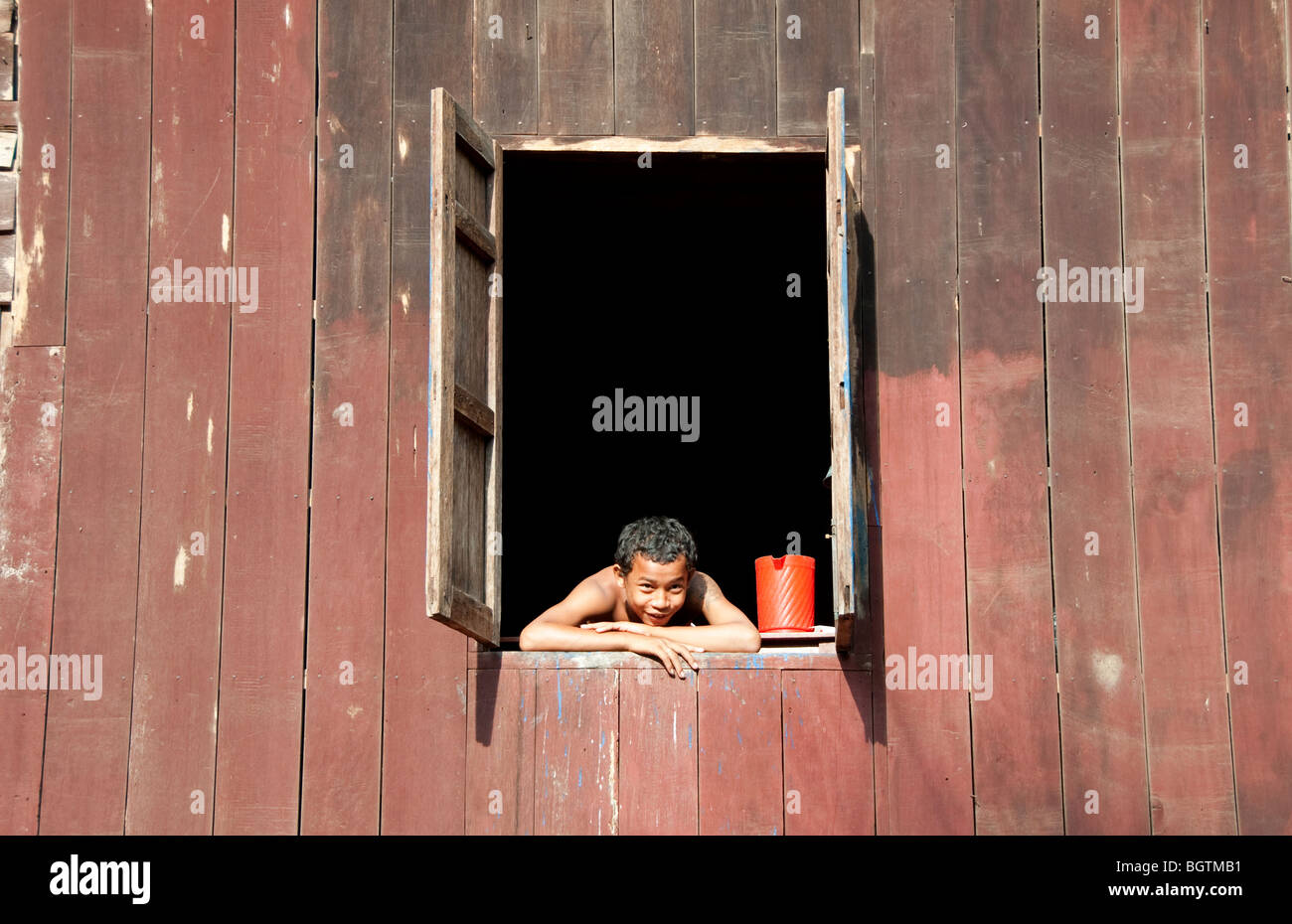 Monk looking out a monastery window at Angkor Wat, Cambodia Stock Photo ...