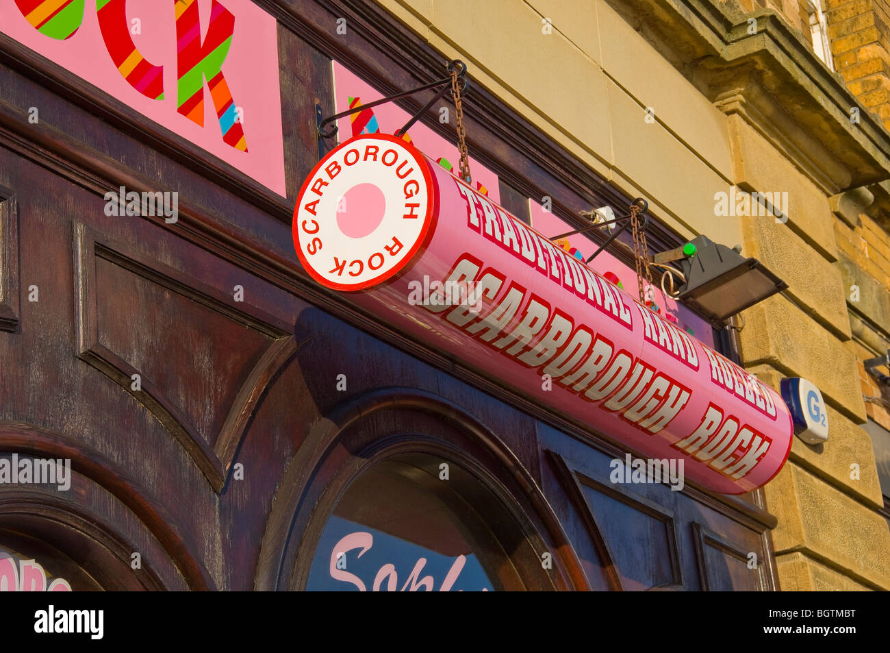 Close up of traditional hand rolled rock shop store sign on Scarborough ...