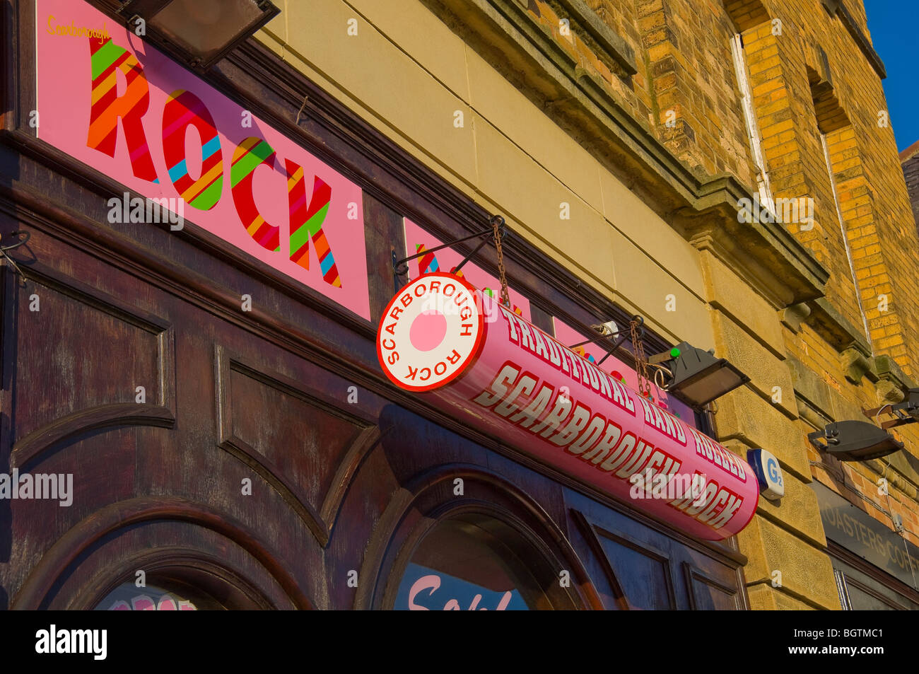 Close up of traditional hand rolled rock shop store sign on Scarborough ...