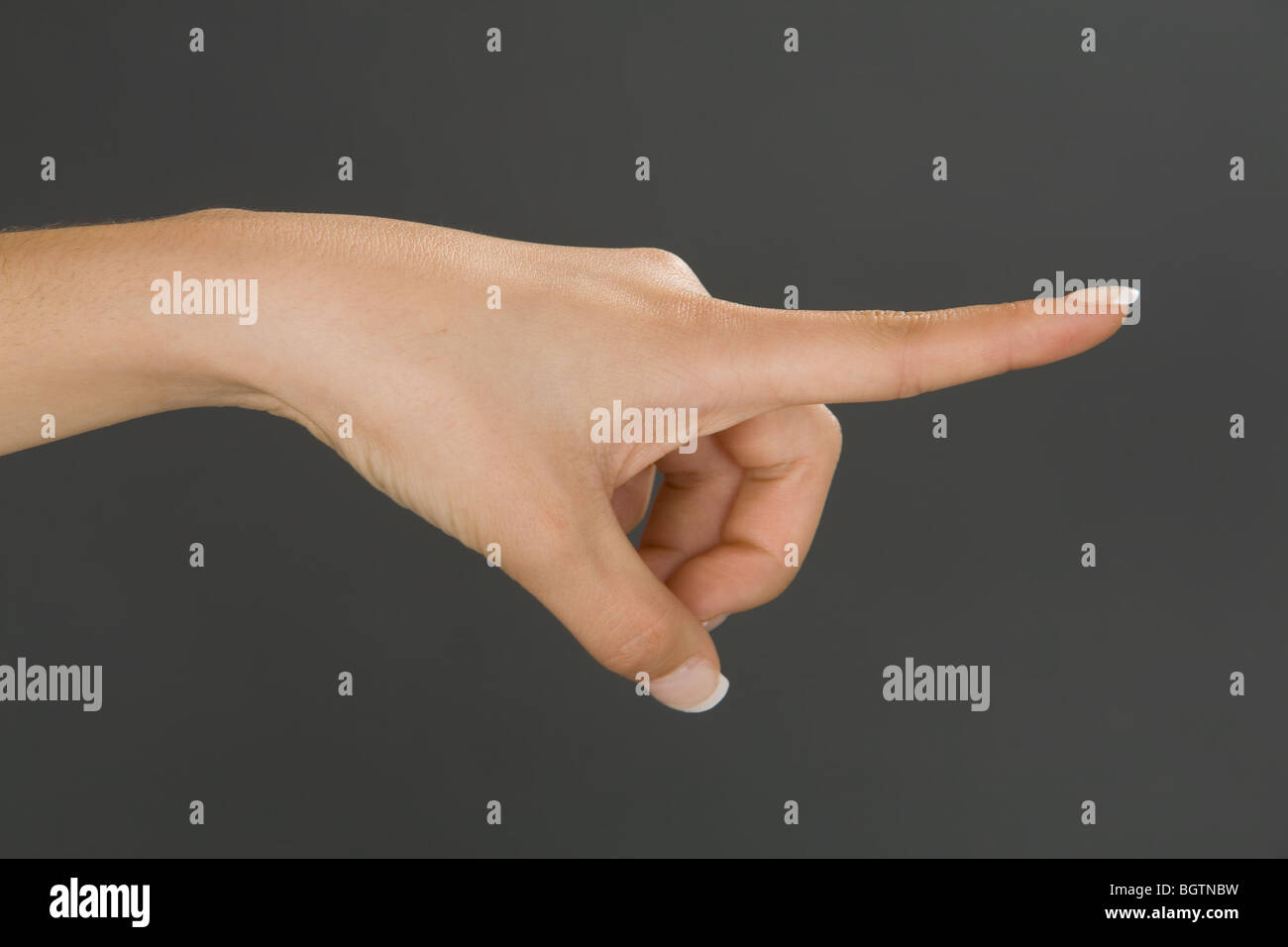 Caucasian female using hand gestures by pointing finger Stock Photo - Alamy