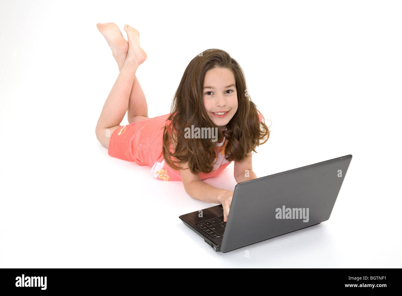 Child playing on a laptop computer on a white background Stock Photo ...