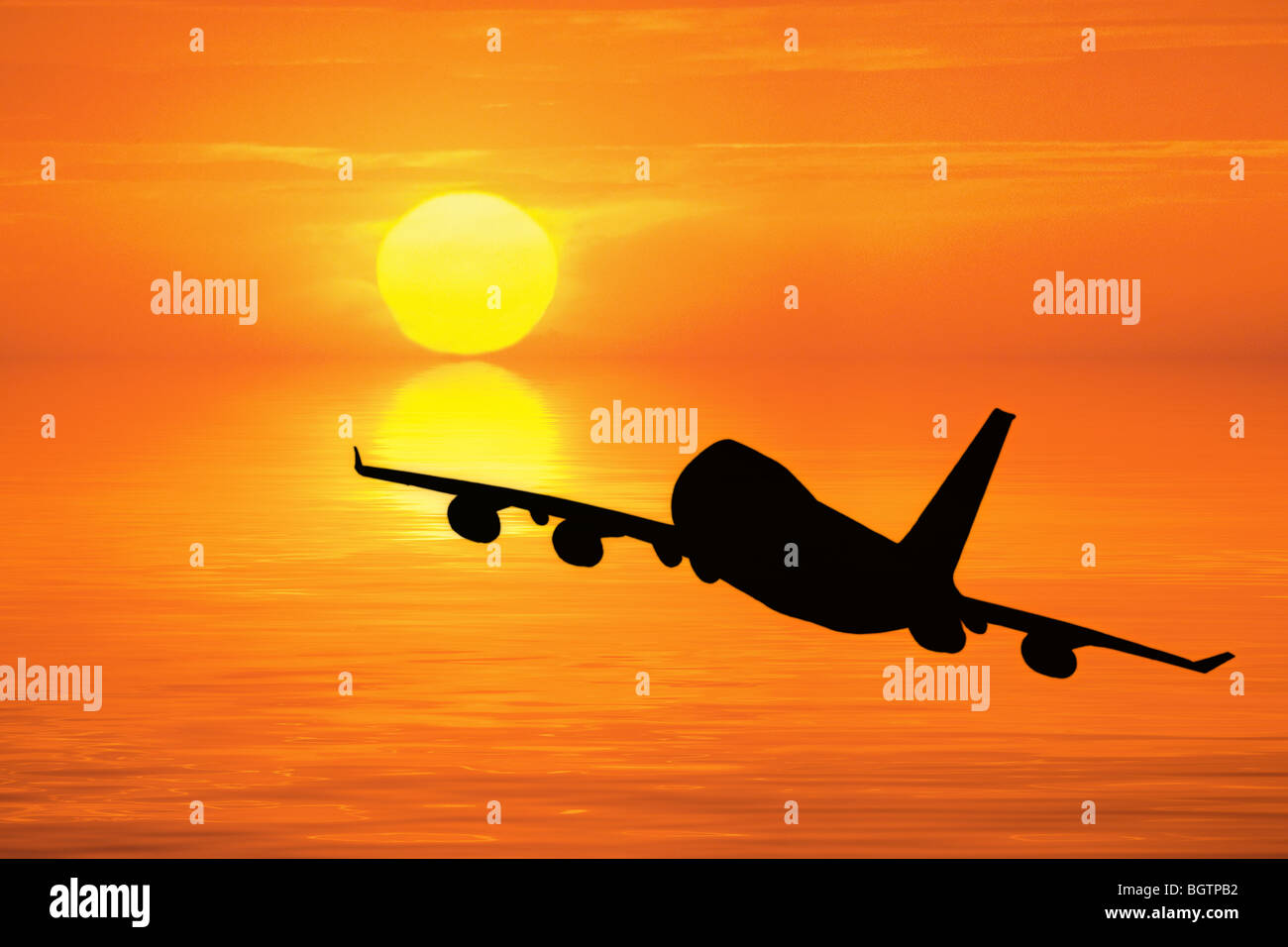 Airliner flying into the sunset over the ocean Stock Photo - Alamy