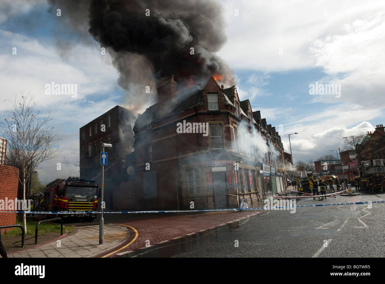 Roof of shop on fire with large flames and smoke Stock Photo - Alamy