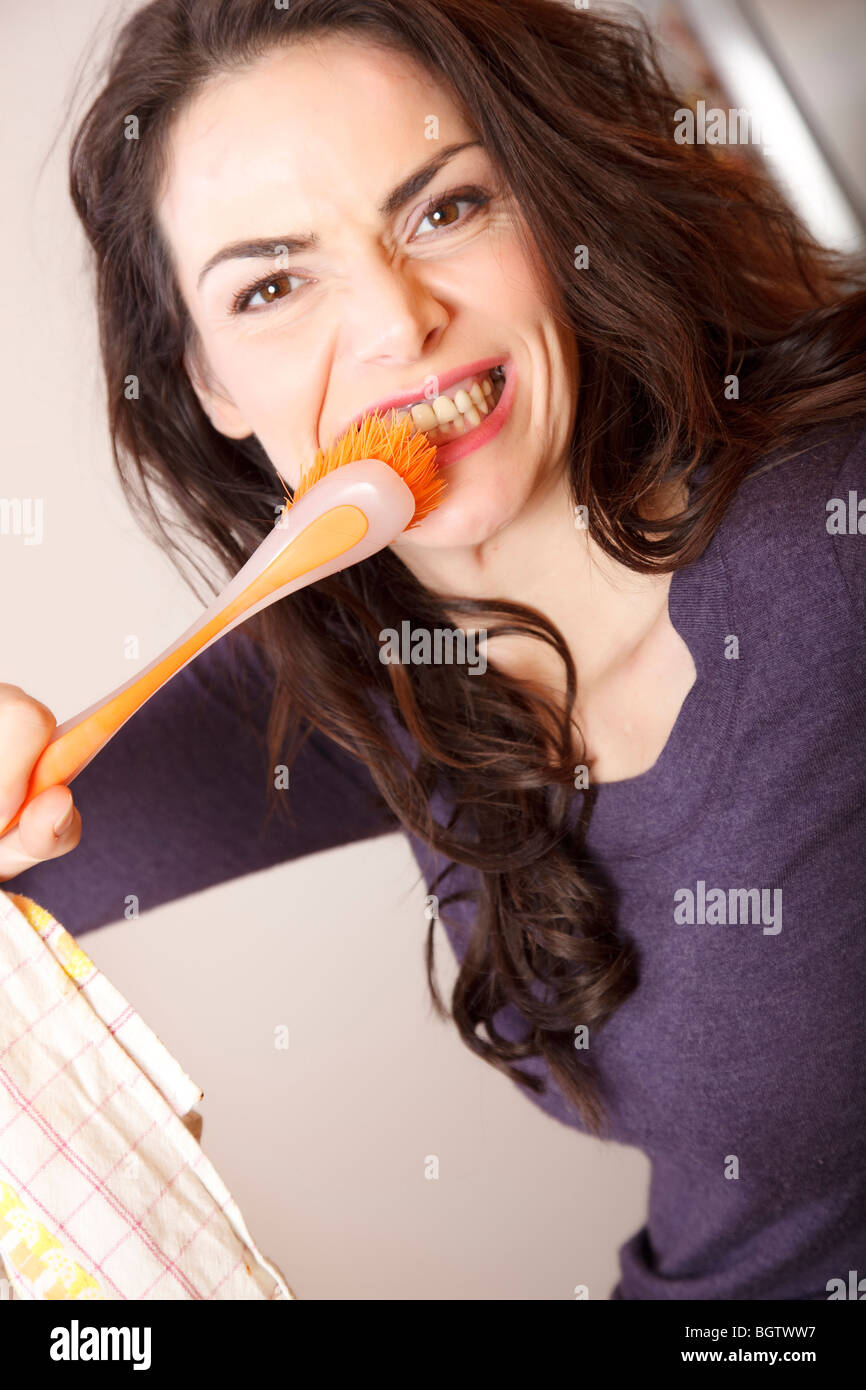 woman brushing her teeth with cleaning brush Stock Photo - Alamy
