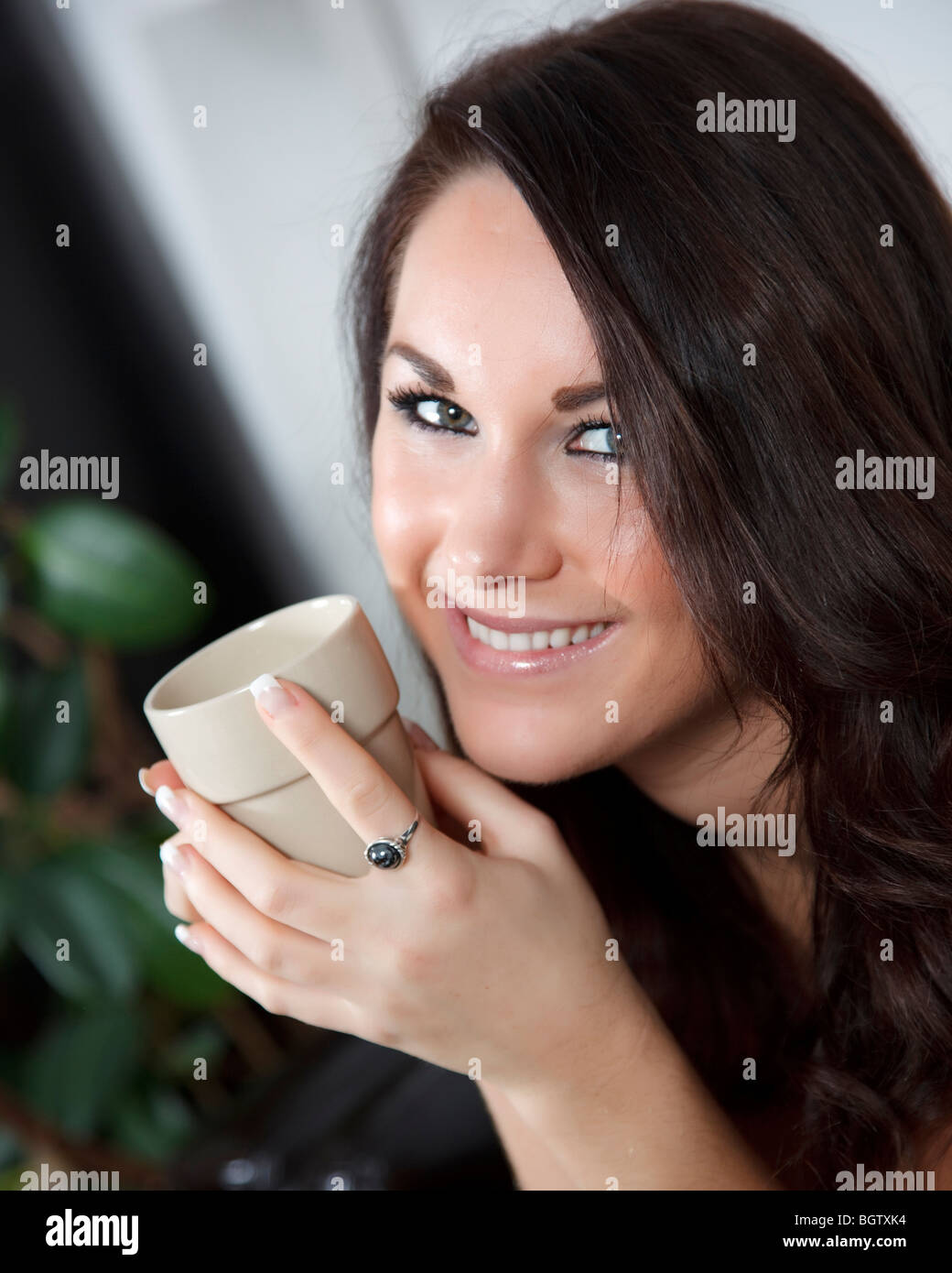 woman relaxing with mug of tea Stock Photo - Alamy