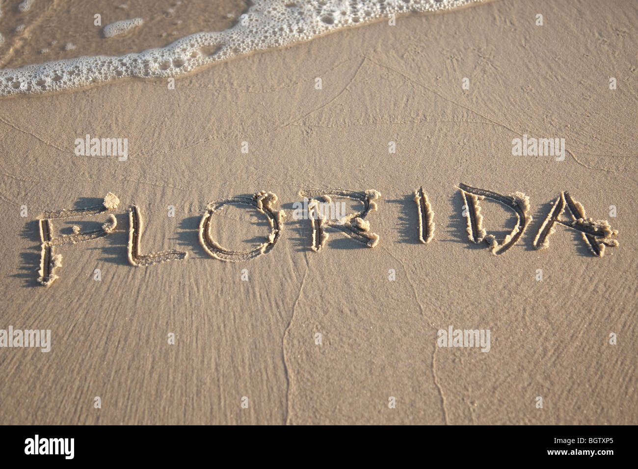 Text written in the beach Stock Photo - Alamy