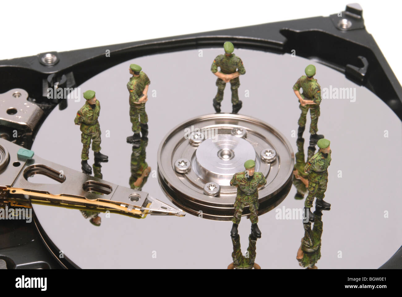 Hard drive with miniature police figures, symbolic image for data ...