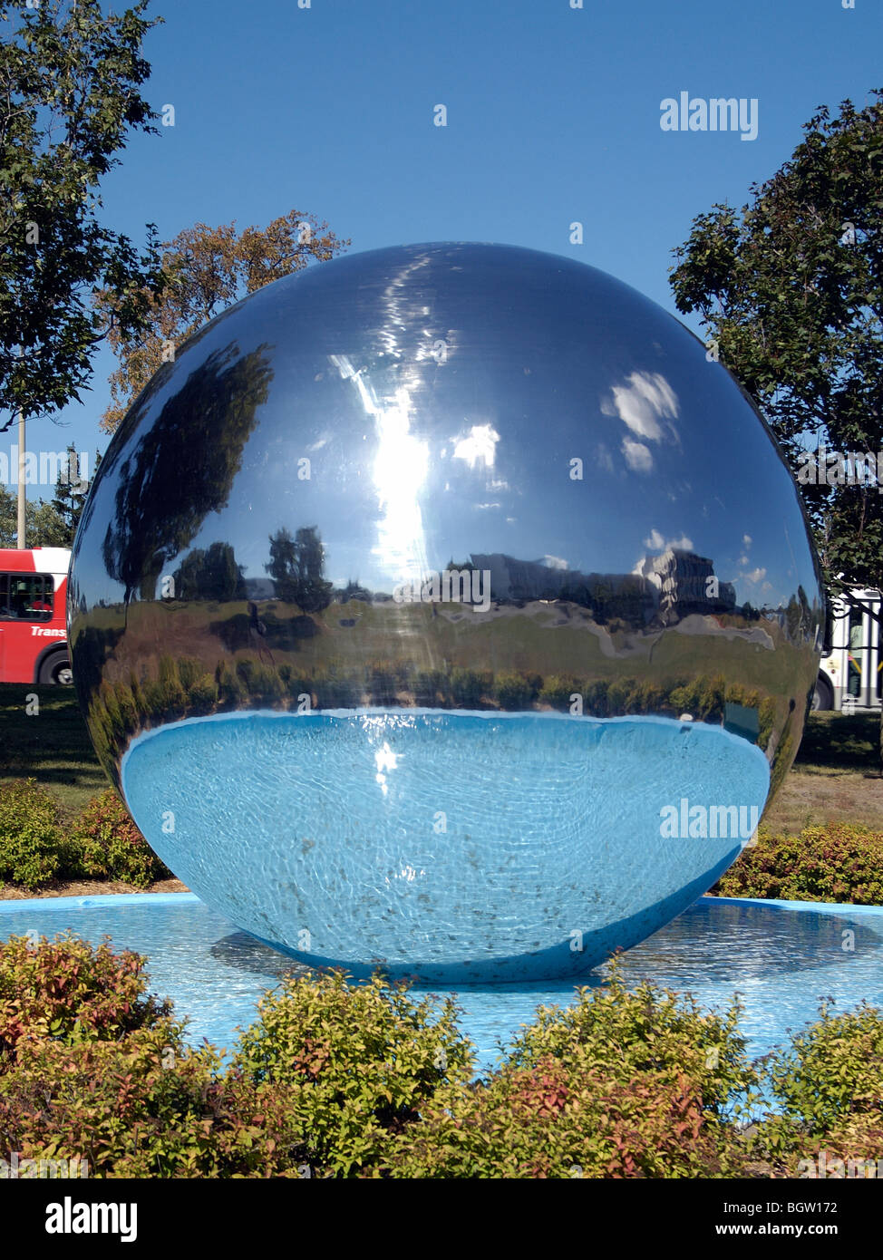 City bus behind the metal ball at the National Research Council Stock ...