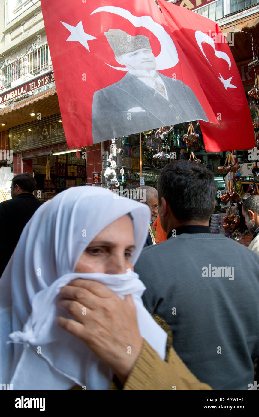 Veiled woman and the image of Kemal Ataturk in a flag near the the ...