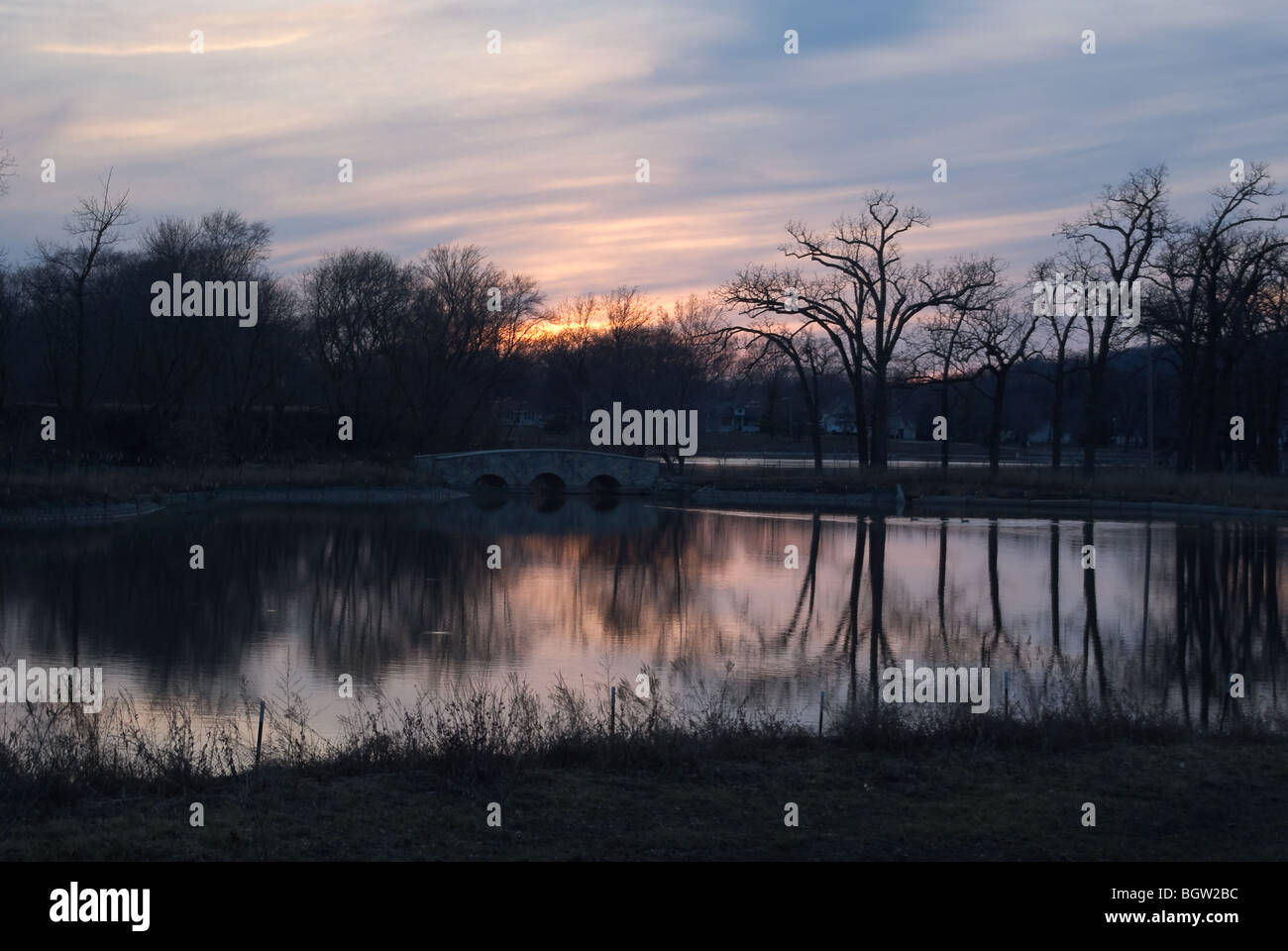 Scene of stone bridge at sunset Stock Photo - Alamy