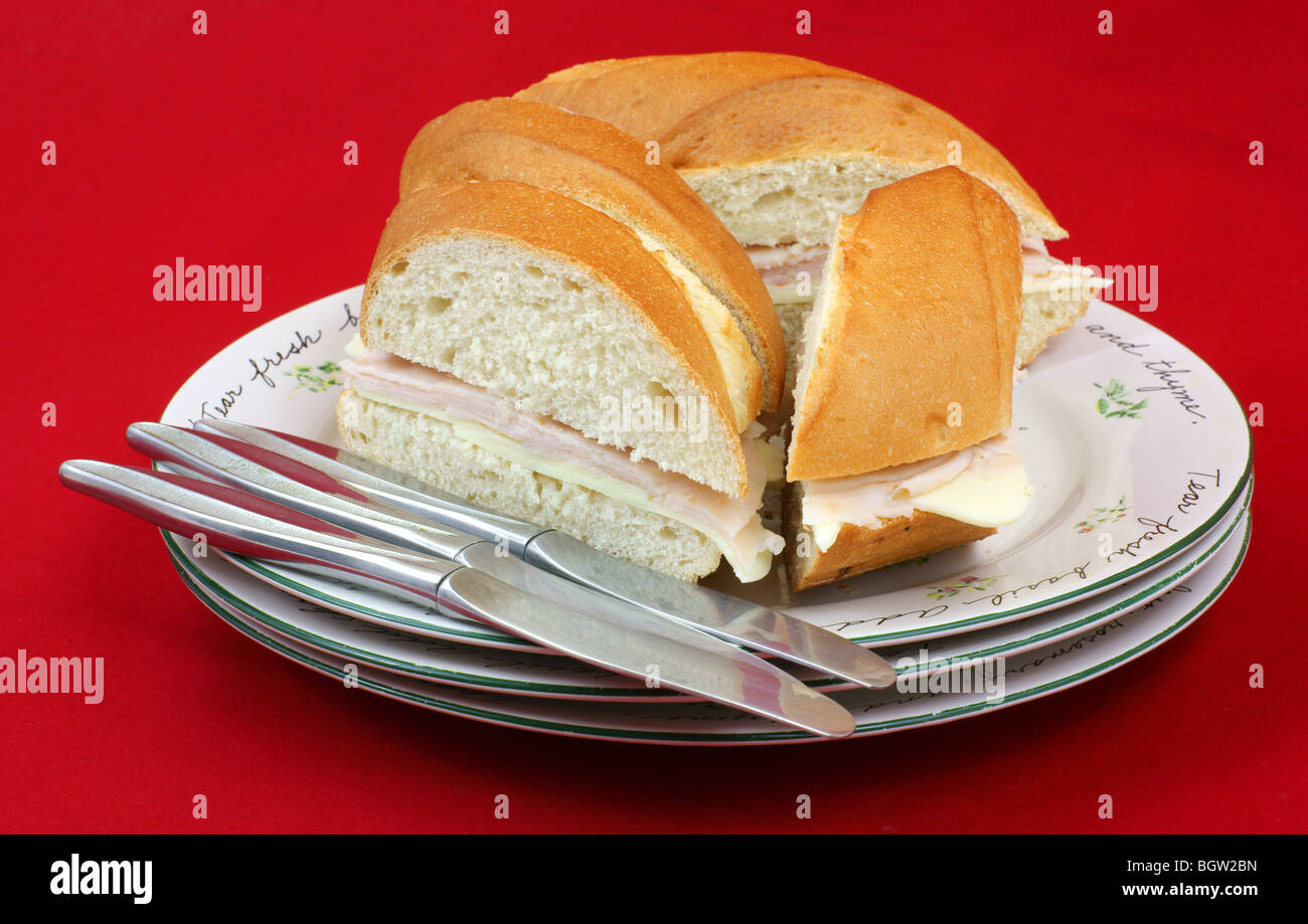 Sandwiches on plates with knives Stock Photo - Alamy