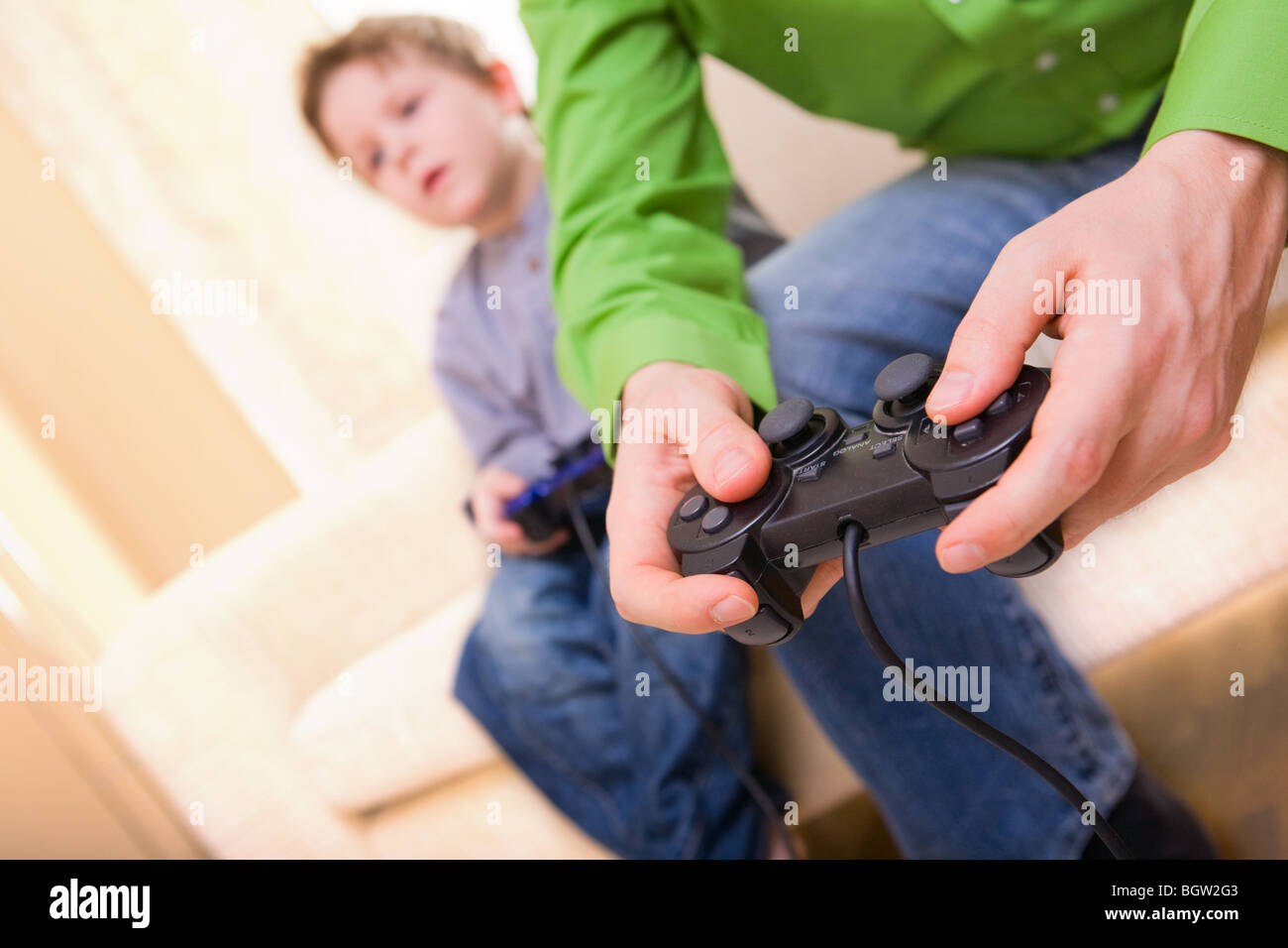 Father and son with video game controllers Stock Photo - Alamy
