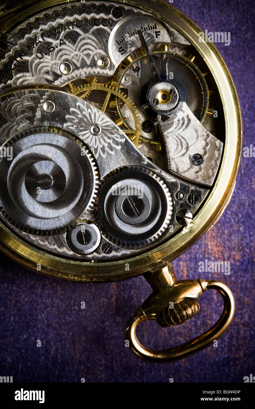 The inner workings of an antique gold pocket watch Stock Photo - Alamy