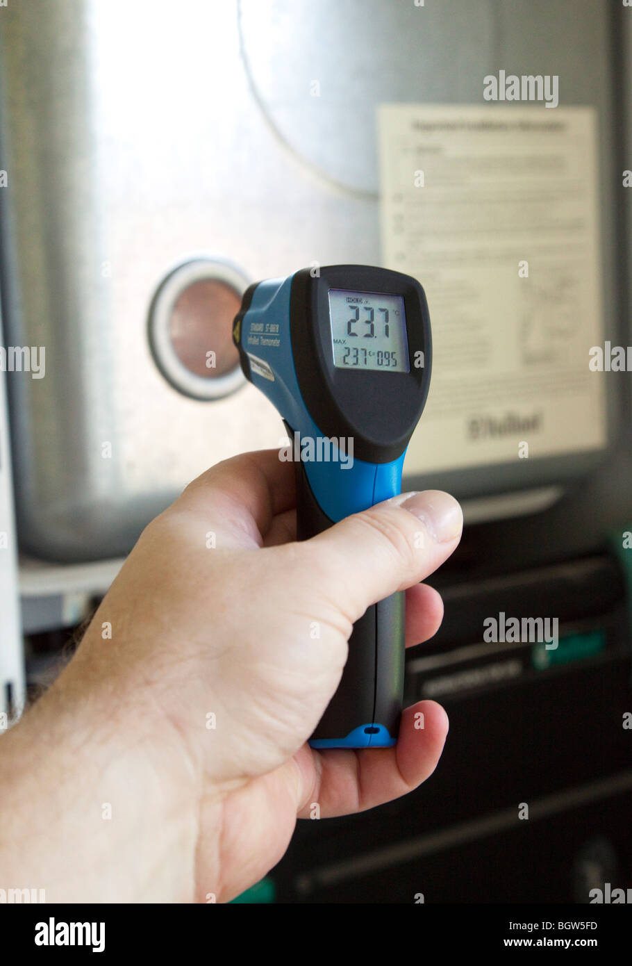 handheld infra red thermometer with digital lcd Stock Photo - Alamy
