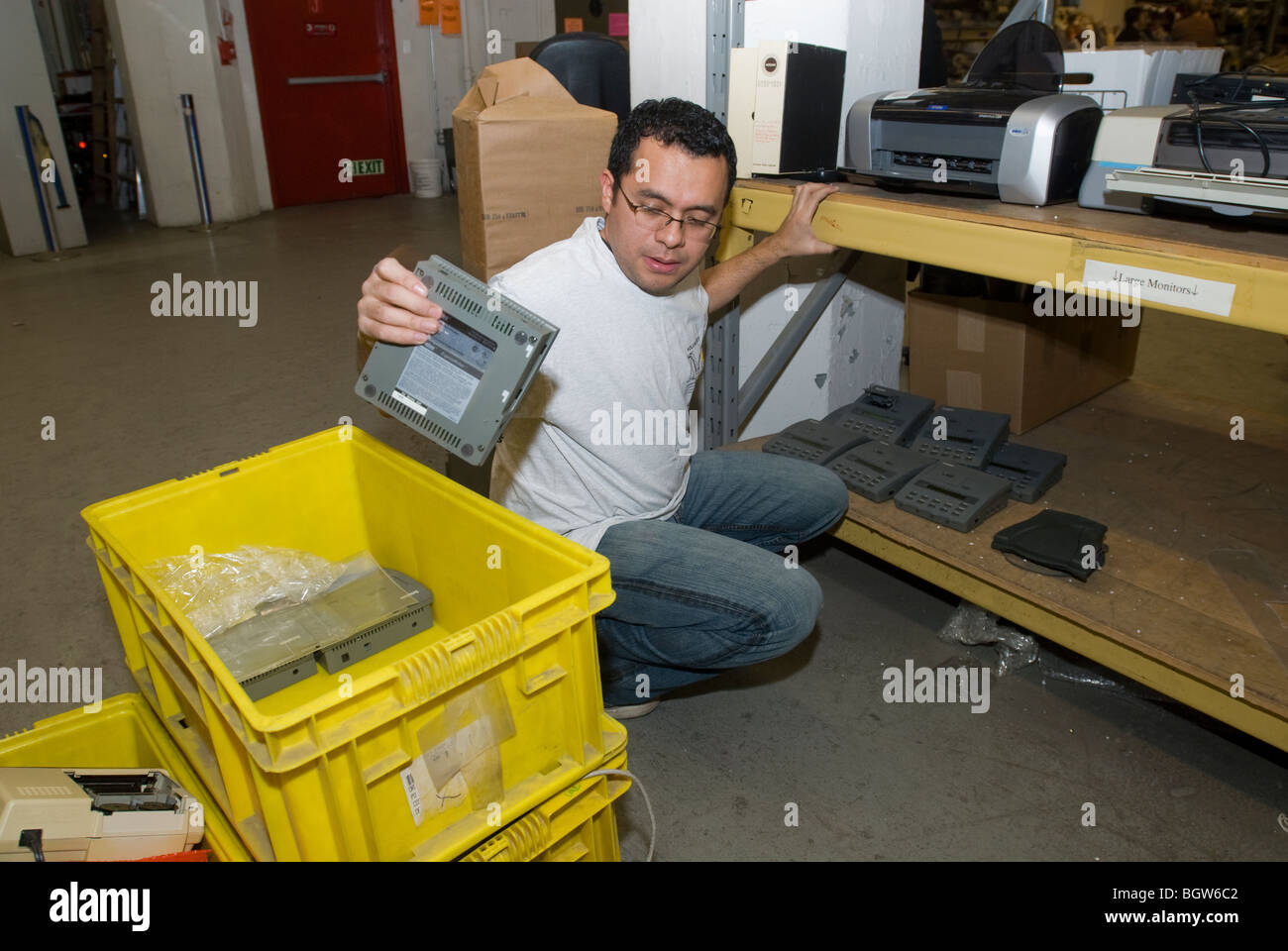 Volunteers sort donated materials at the Material for the Arts (MFTA ...