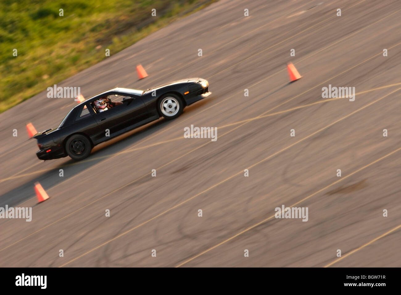 Learning to drive around pylons Stock Photo - Alamy