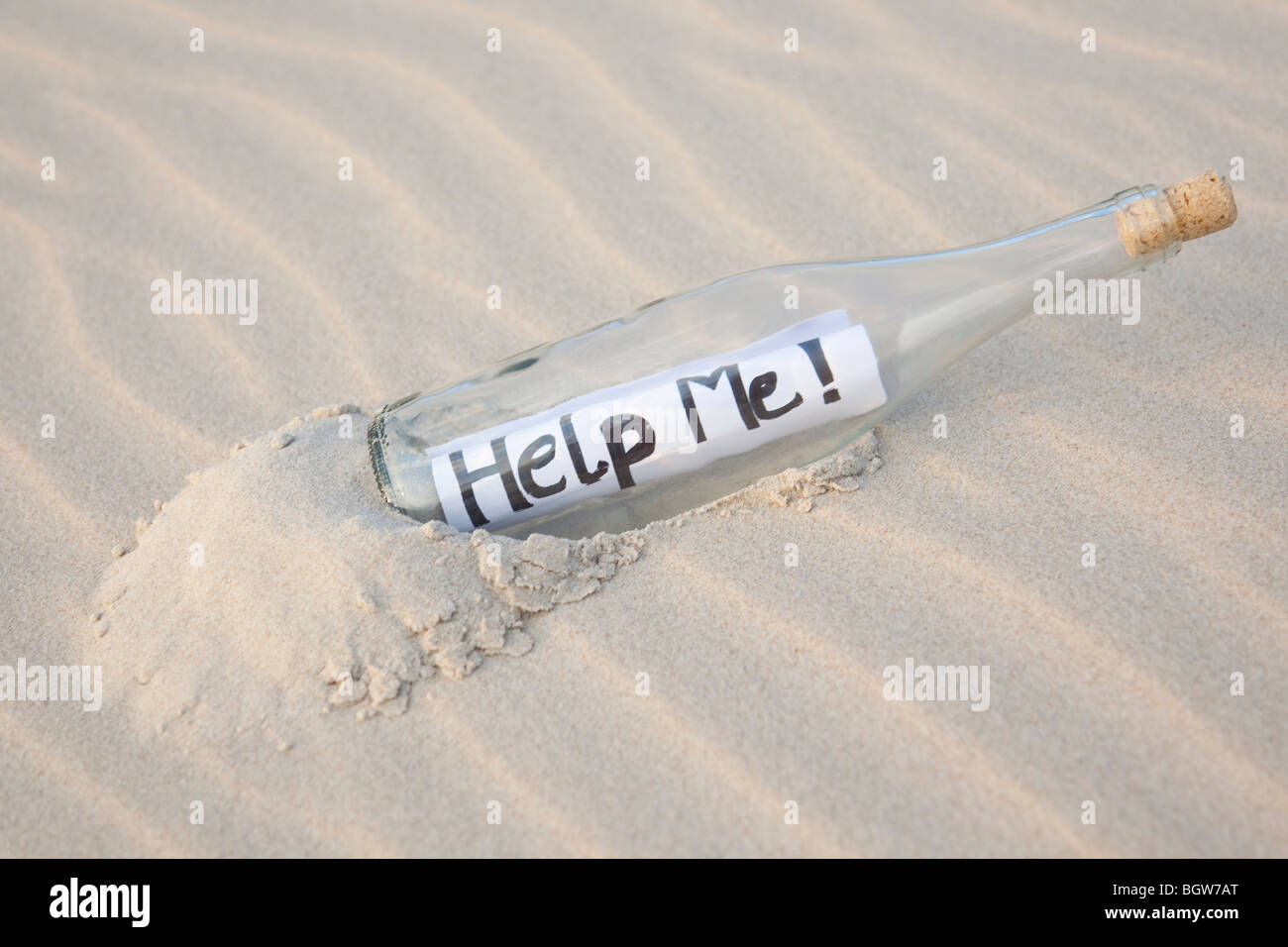 A clear glass bottle washed up on the beach Stock Photo - Alamy