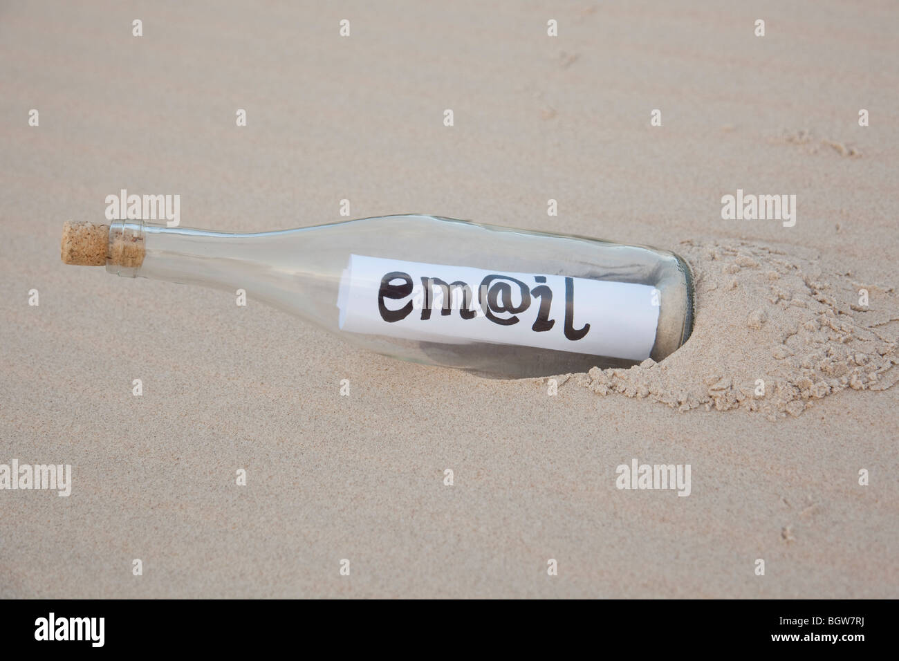 A clear glass bottle washed up on the beach Stock Photo - Alamy