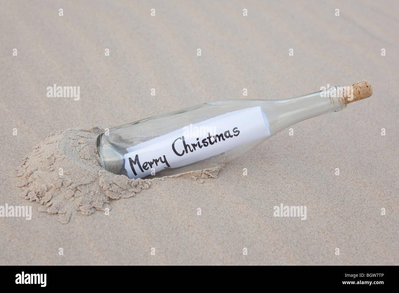 A clear glass bottle washed up on the beach Stock Photo - Alamy