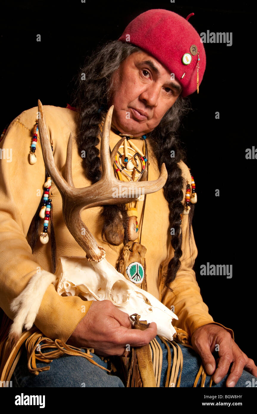 Native american indian on black background with red hat long braids ...