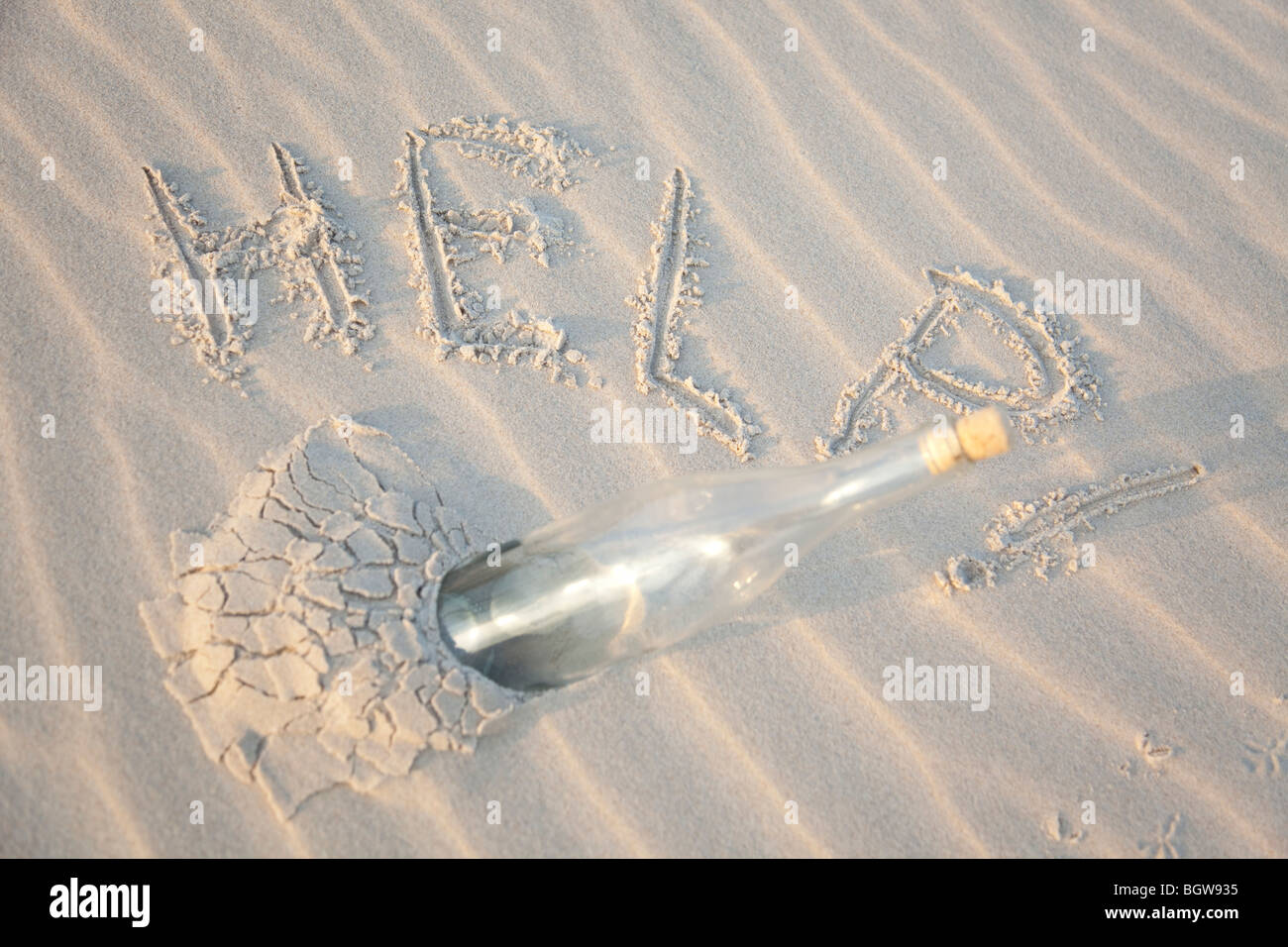 A clear glass bottle washed up on the beach Stock Photo - Alamy
