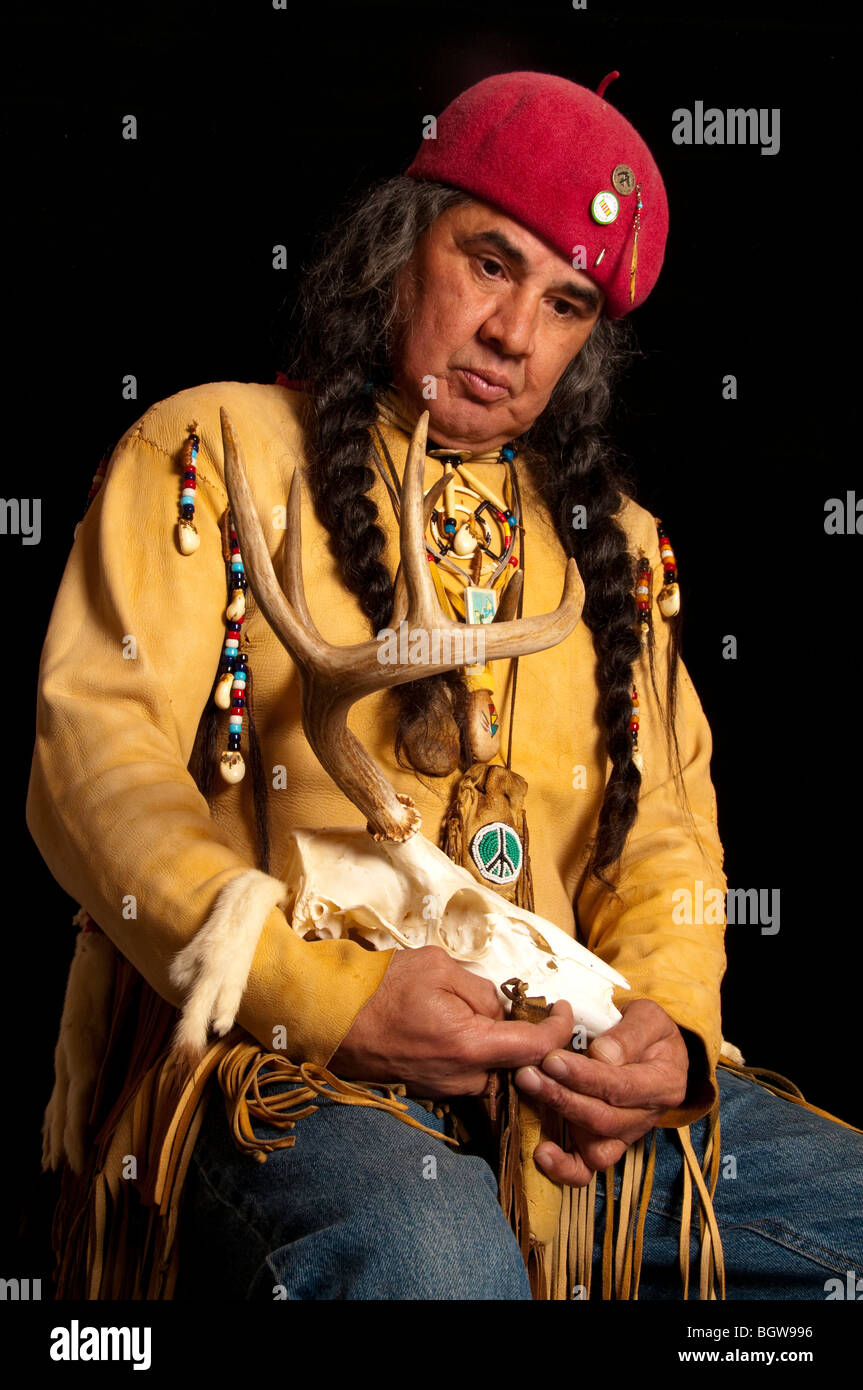 Native american indian on black background with red hat long braids ...