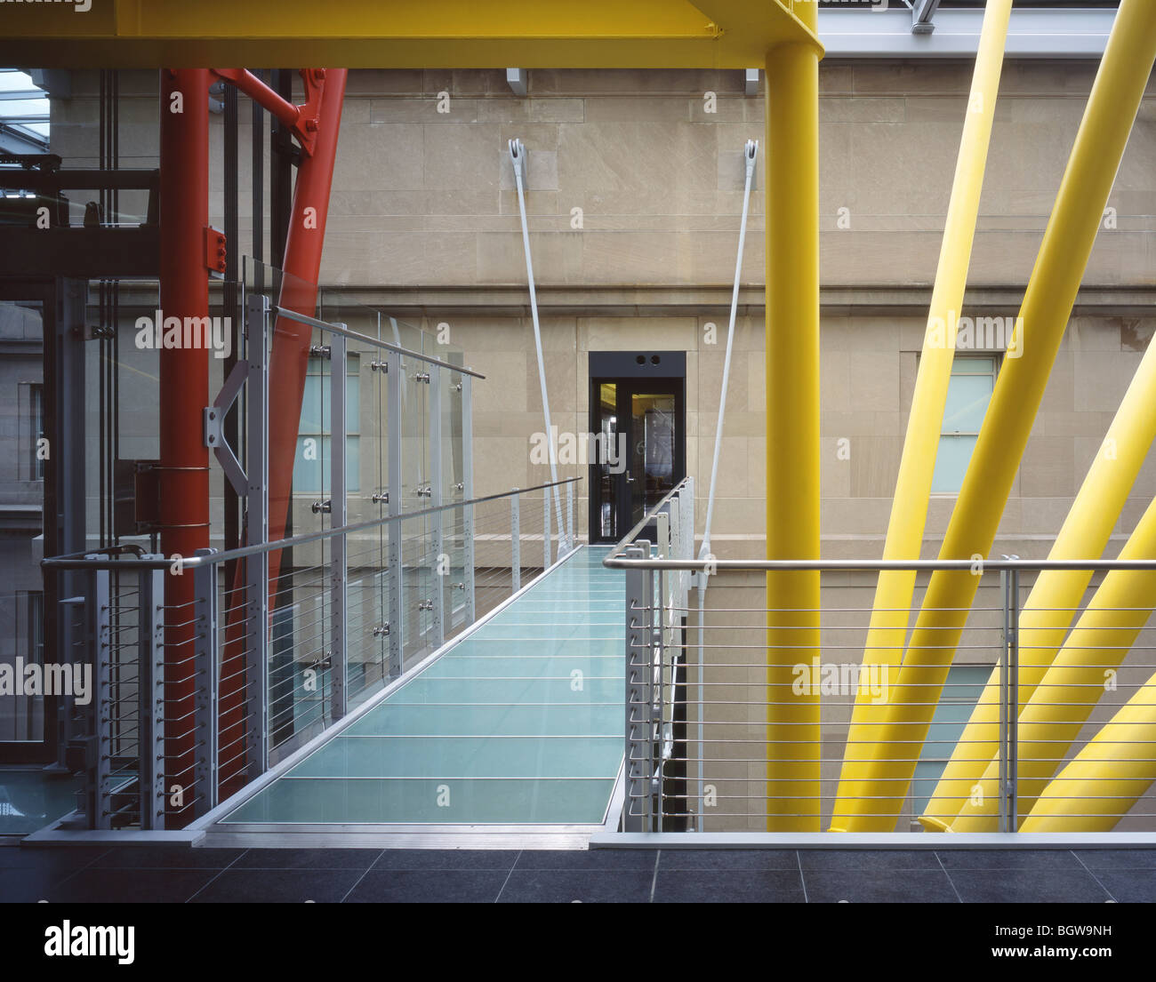 glass walkway framed by coloured sections of support structure Stock ...