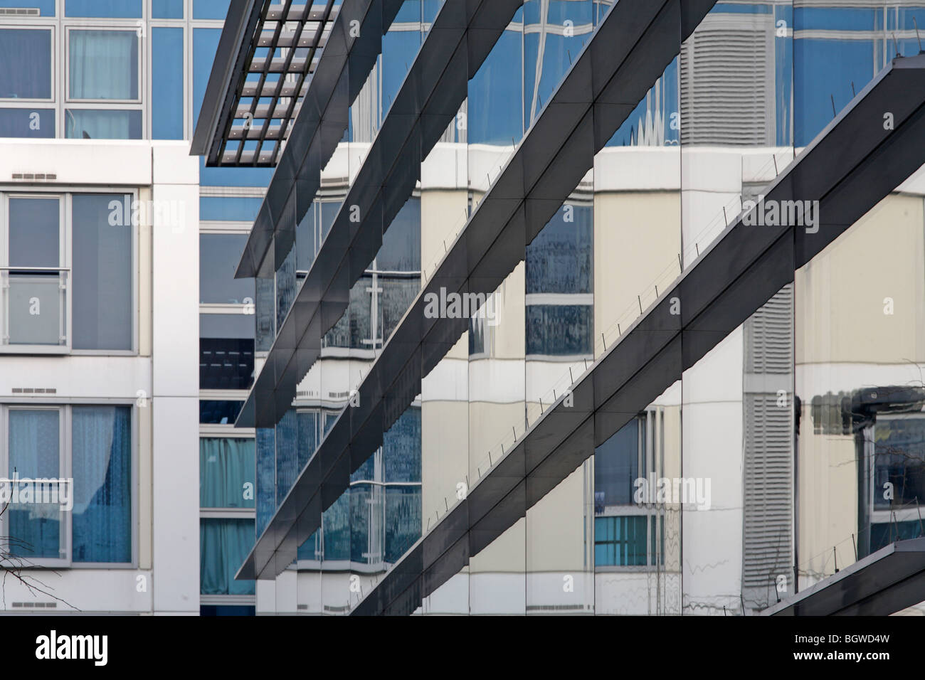 swiss cottage leisure centre, glazed facade with visage building in ...
