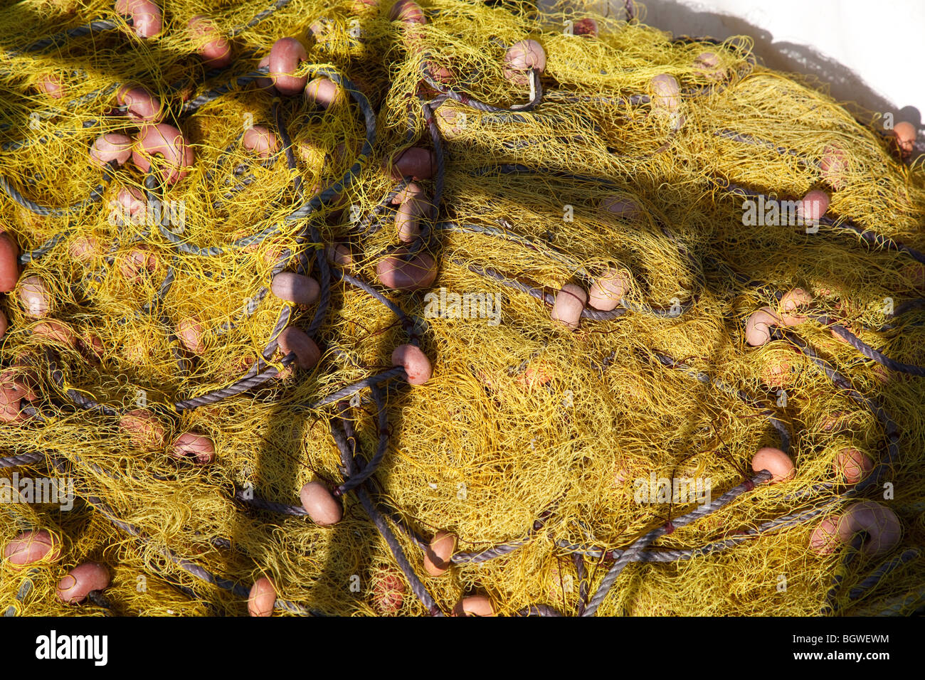 yellow fishing net Stock Photo - Alamy