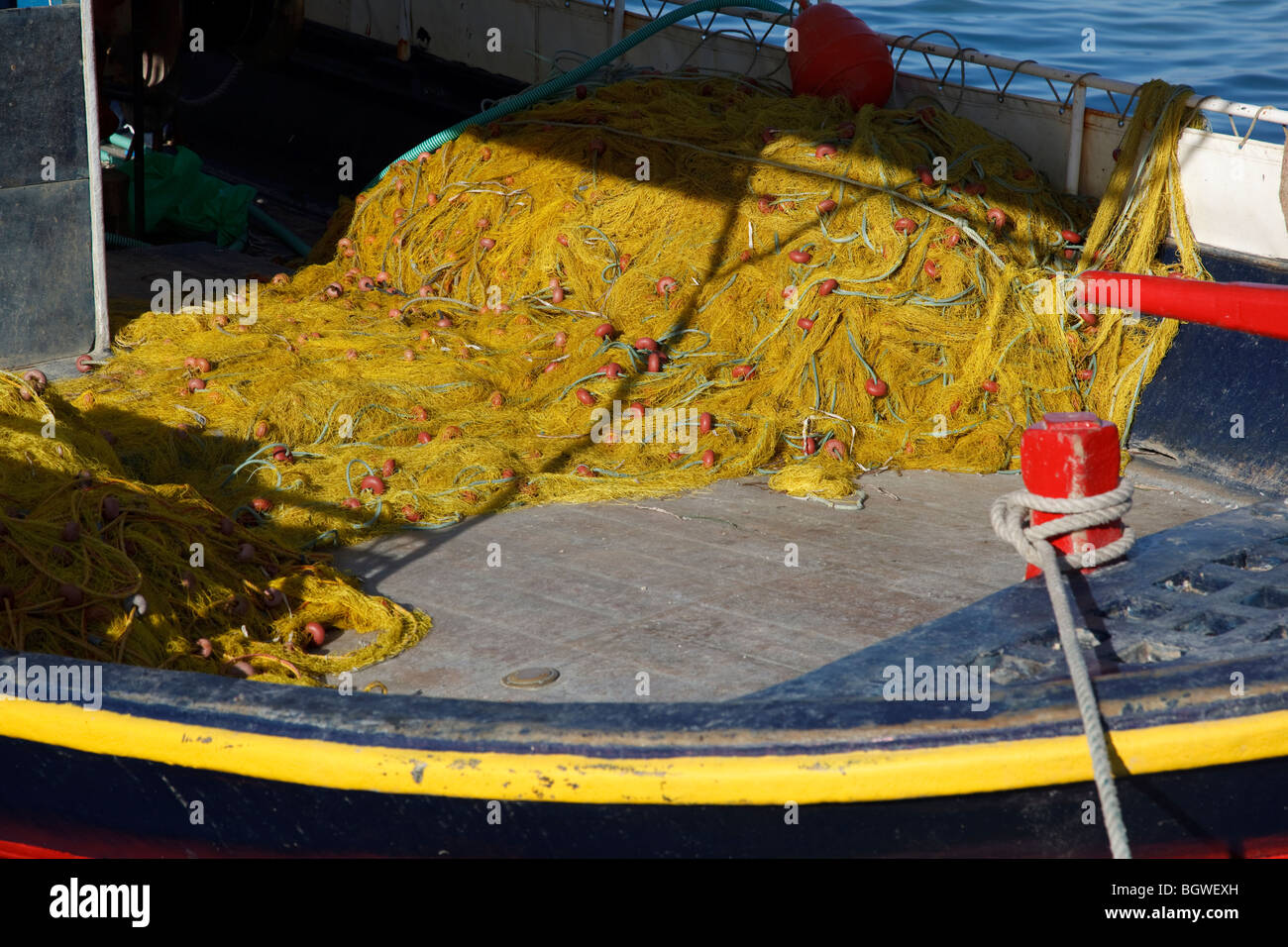 yellow fishing net on fishing boat Stock Photo - Alamy