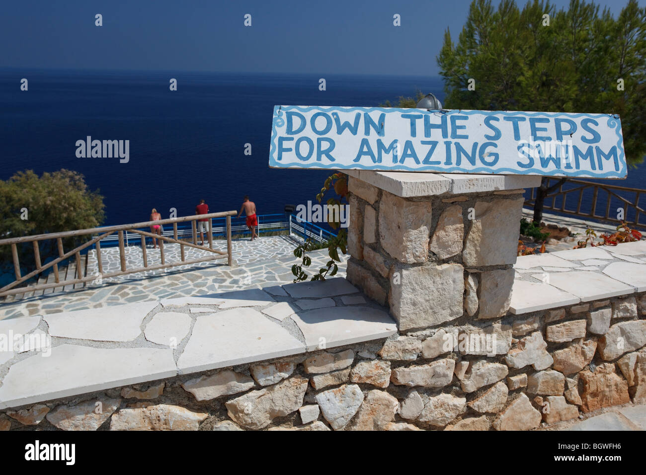 sign "Down the steps for amazing swim Stock Photo - Alamy