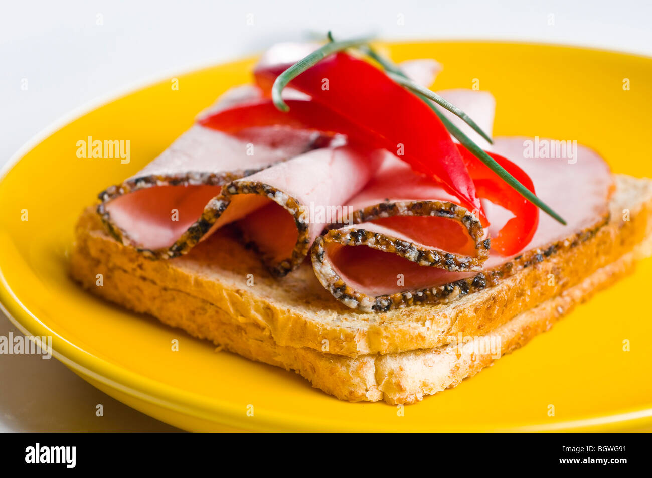 whole wheat toast on a yellow plate Stock Photo - Alamy