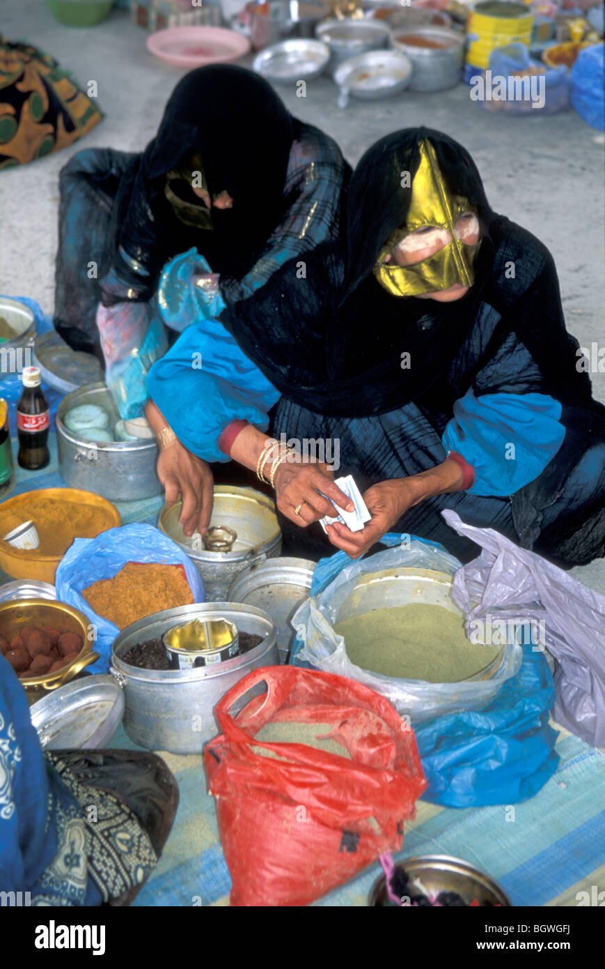 Bedouin woman in mask or burqa shopping at the weekly woman`s souk in ...